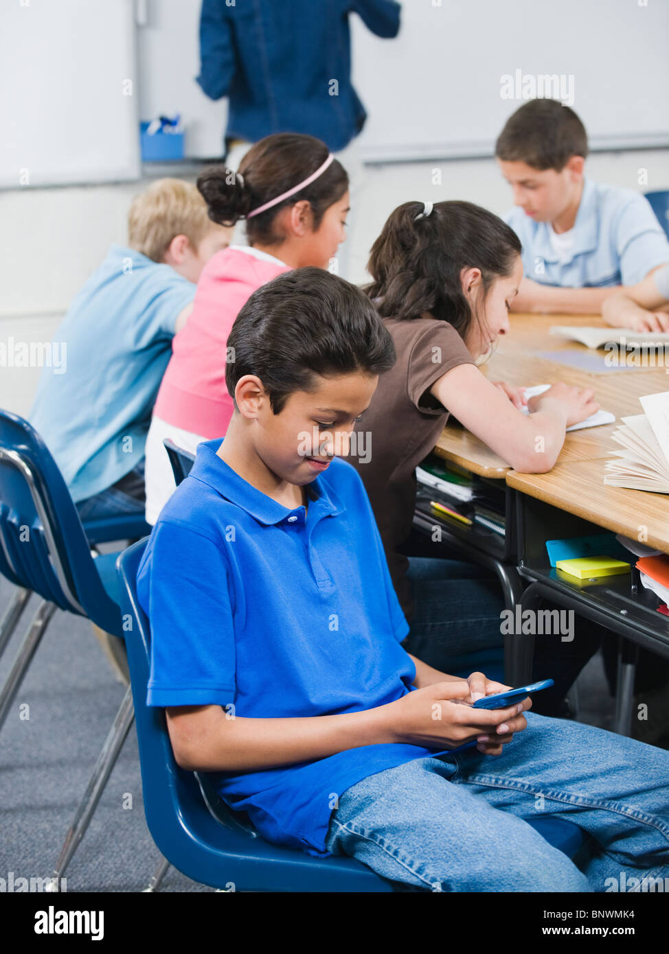 Elementary school students cell phone hi-res stock photography and ...