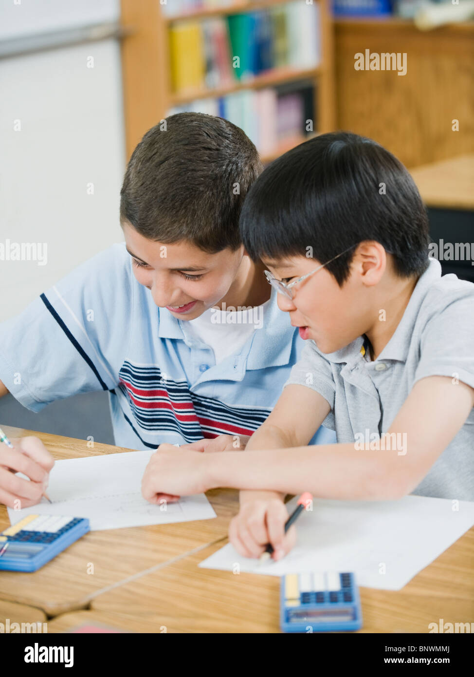 Students doing math work in classroom Stock Photo - Alamy