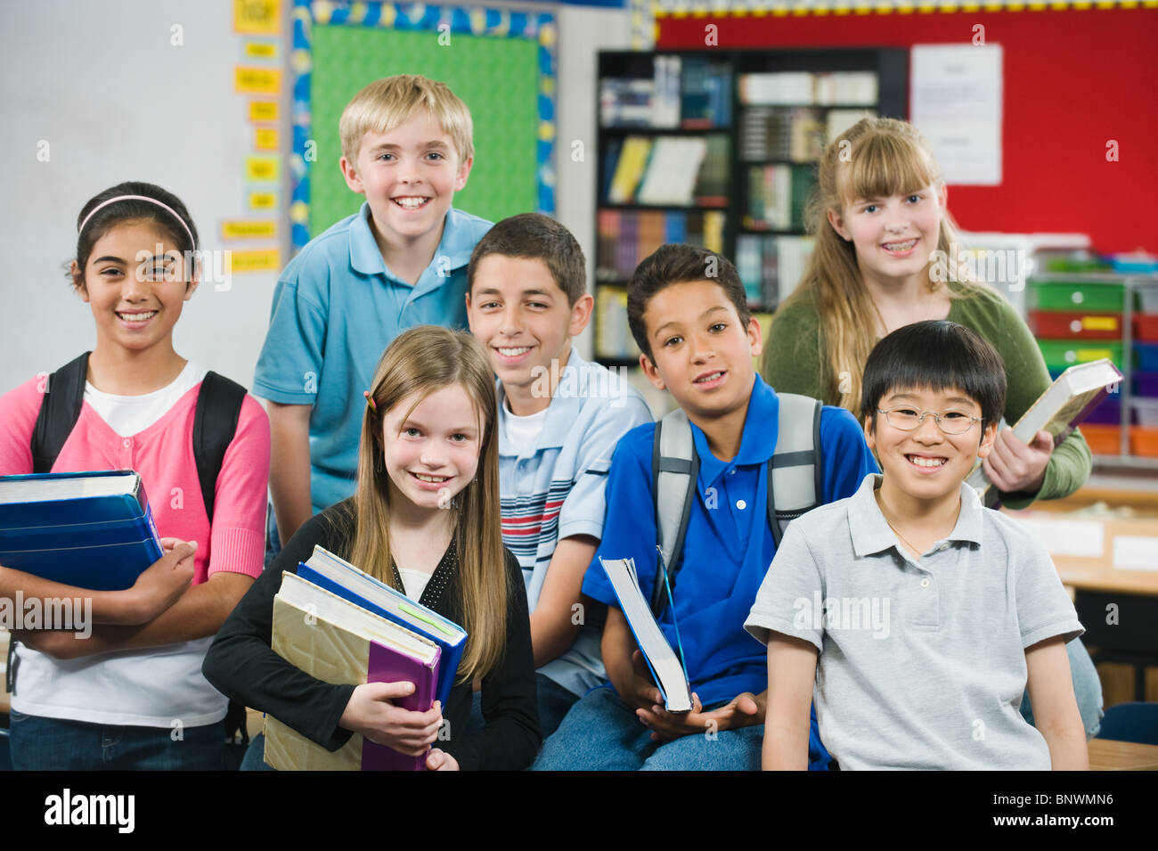 Group of elementary school students in classroom Stock Photo - Alamy