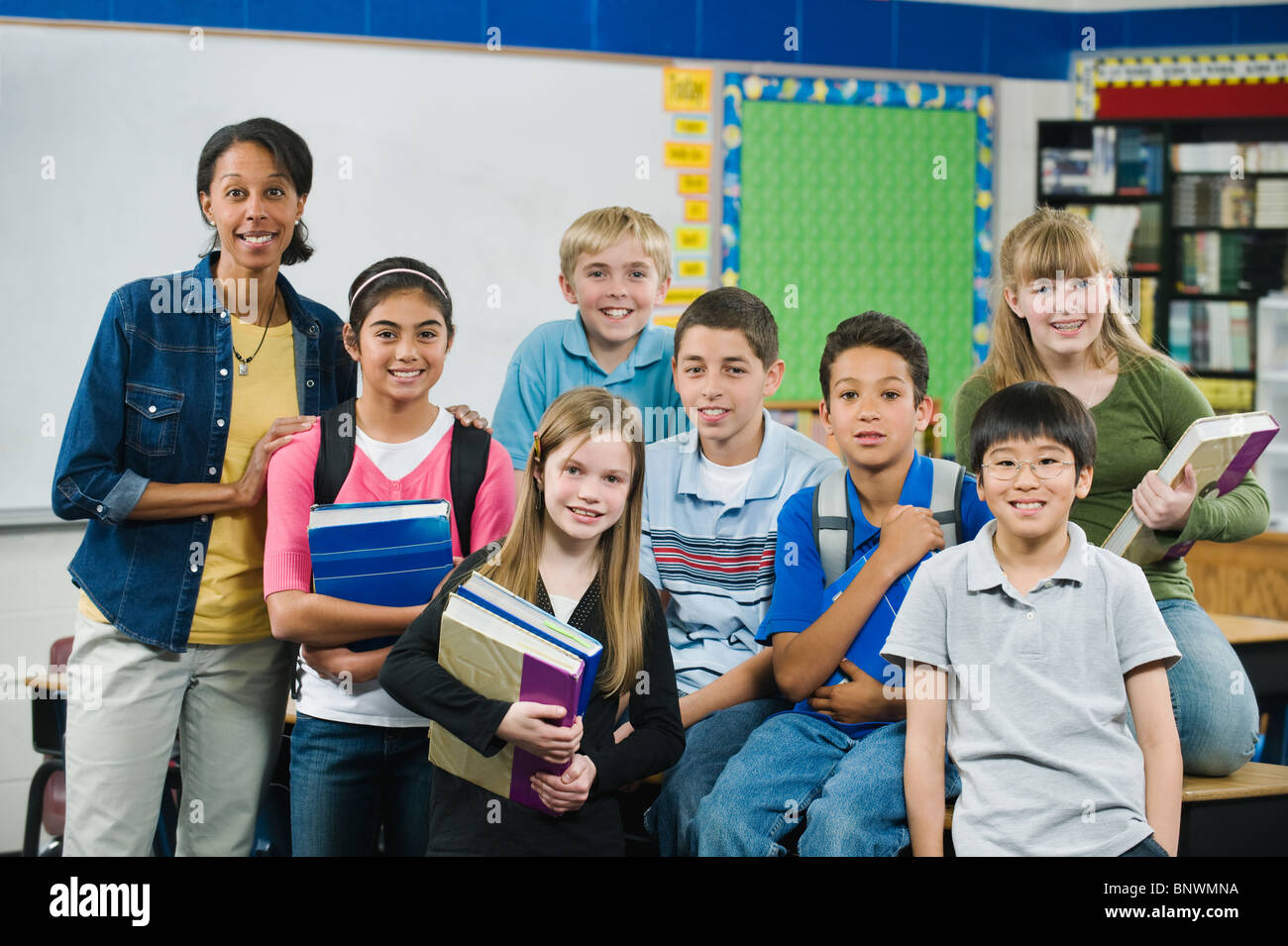 Group of elementary school students in classroom Stock Photo - Alamy