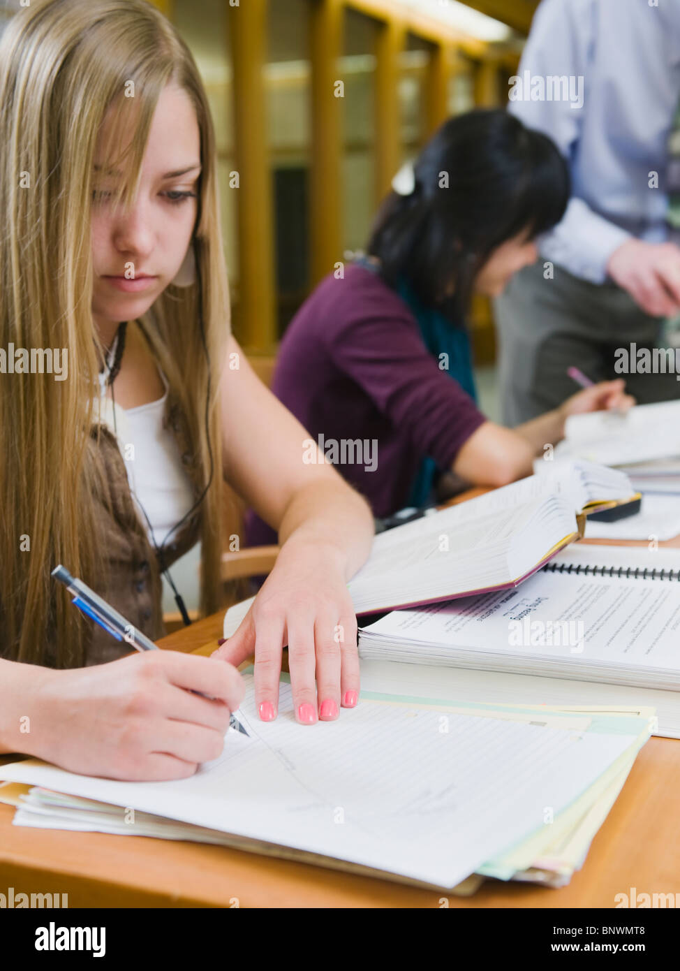 College students working in library Stock Photo - Alamy