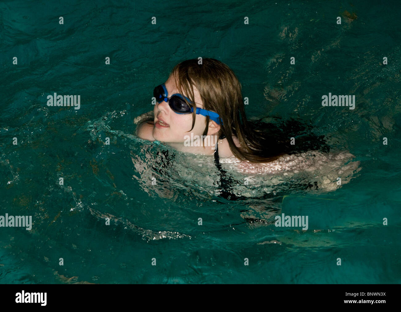 Girl Swimming at Night Stock Photo - Alamy
