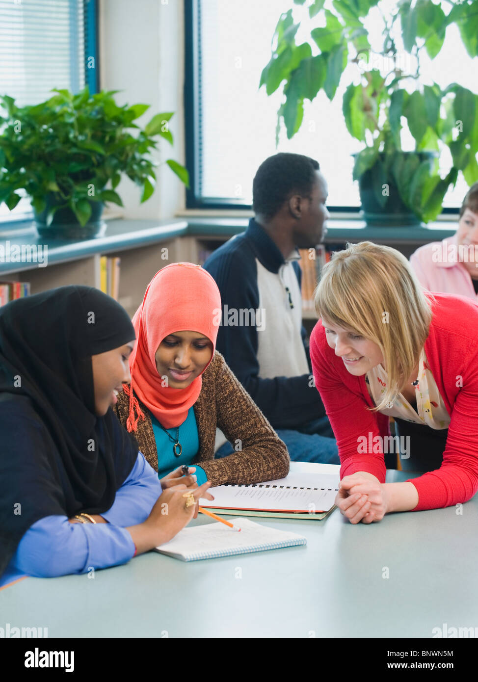 Adults students learning English as a second language Stock Photo - Alamy