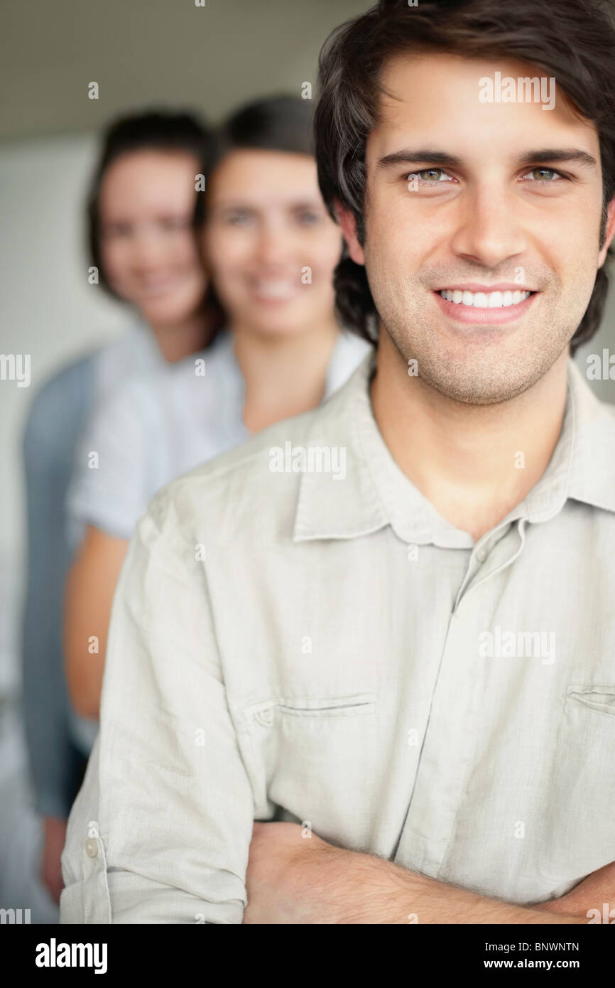 three people standing in a row Stock Photo - Alamy