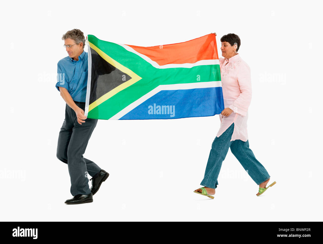 two people carrying the South African flag Stock Photo - Alamy