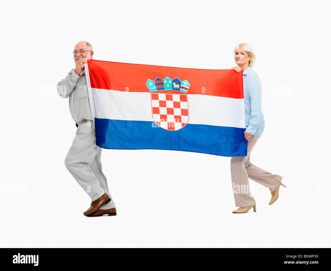 two people carrying the Croatian flag Stock Photo - Alamy