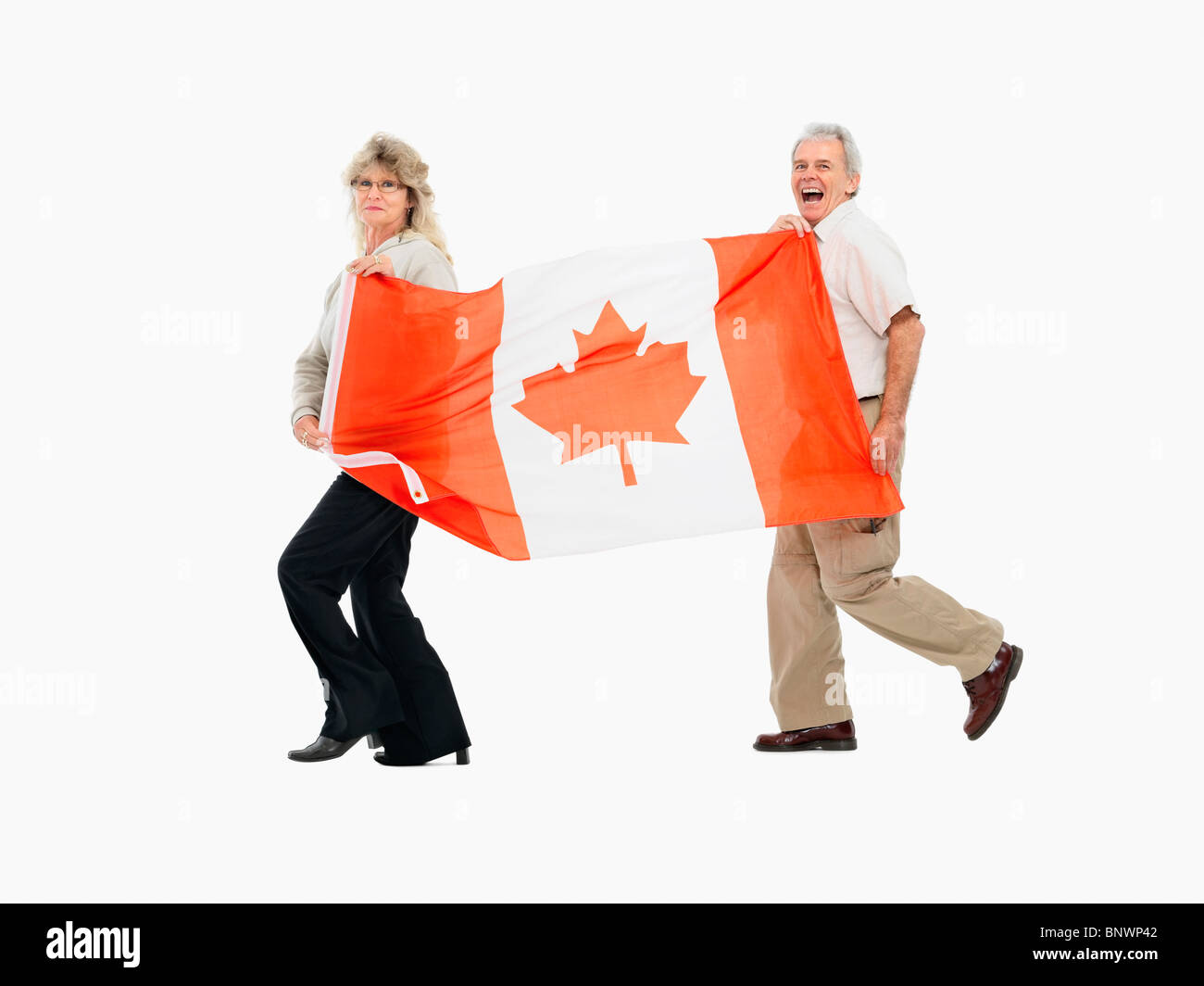 two people carrying the Canadian flag Stock Photo - Alamy