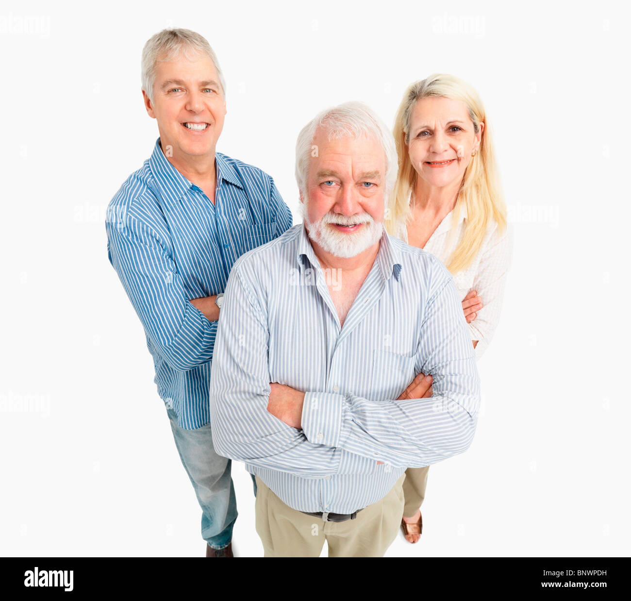 three people standing with their arms crossed Stock Photo - Alamy