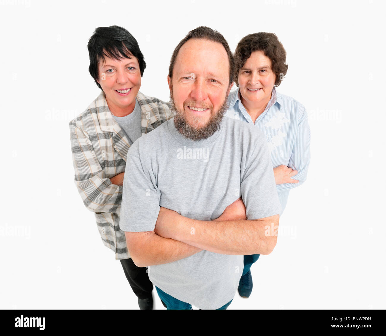three people standing with their arms crossed Stock Photo - Alamy