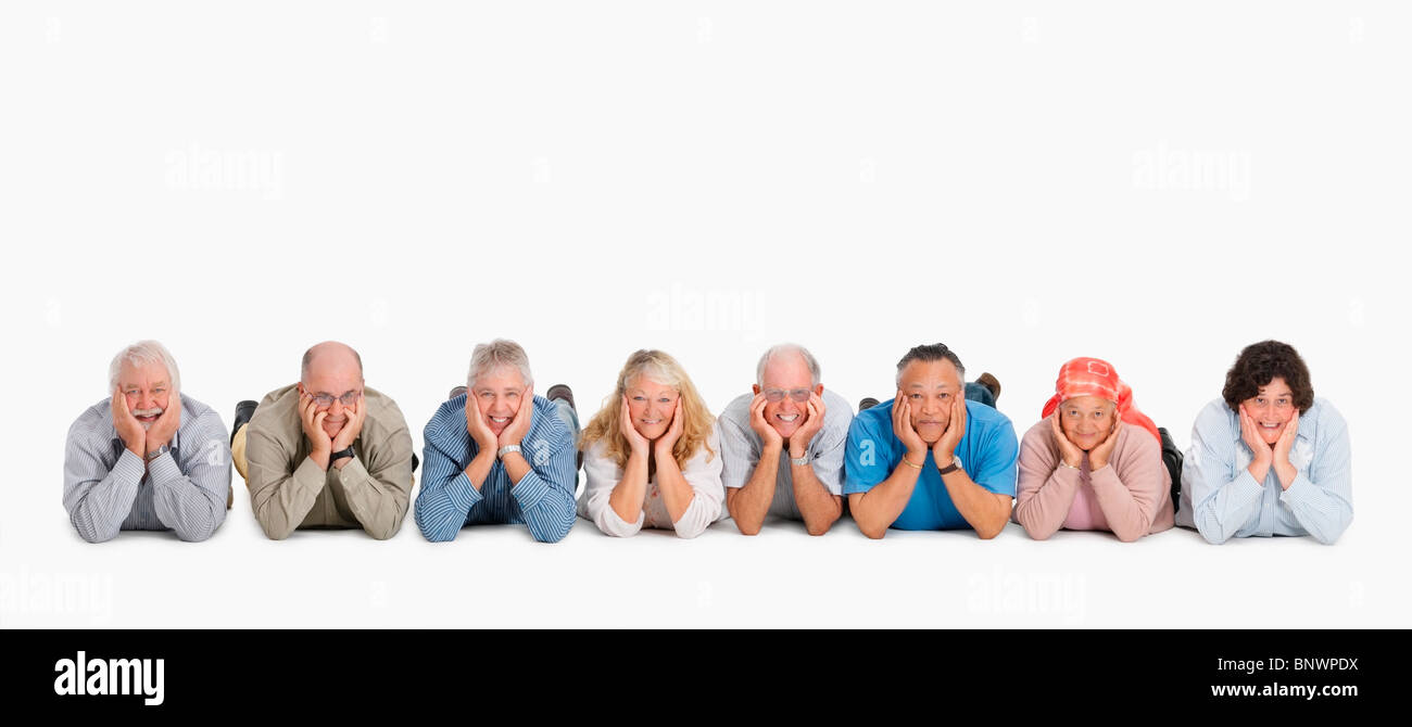 A group of people lying on the floor in a row Stock Photo - Alamy