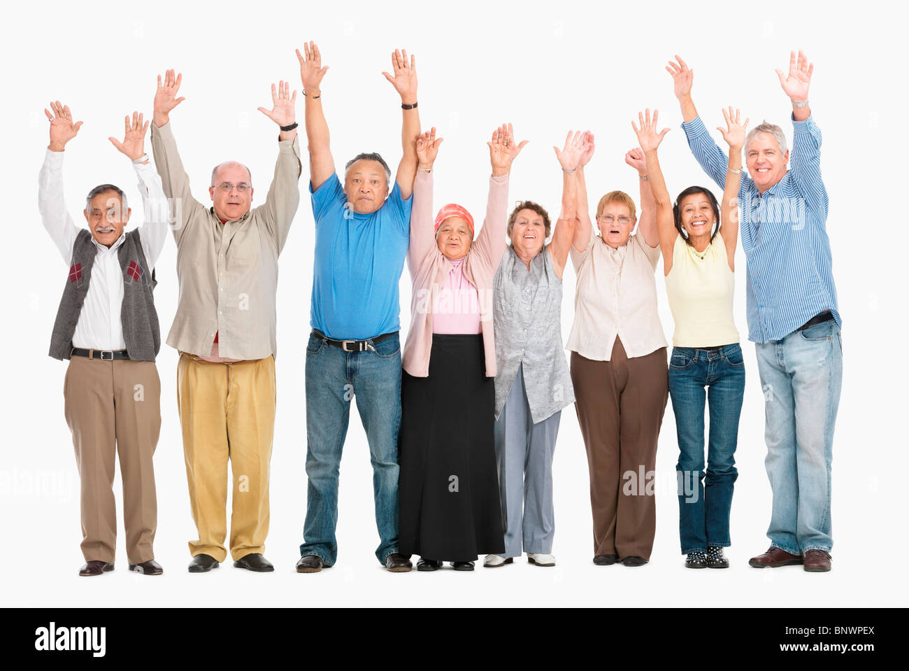 A group of people standing in a row raising their arms Stock Photo - Alamy