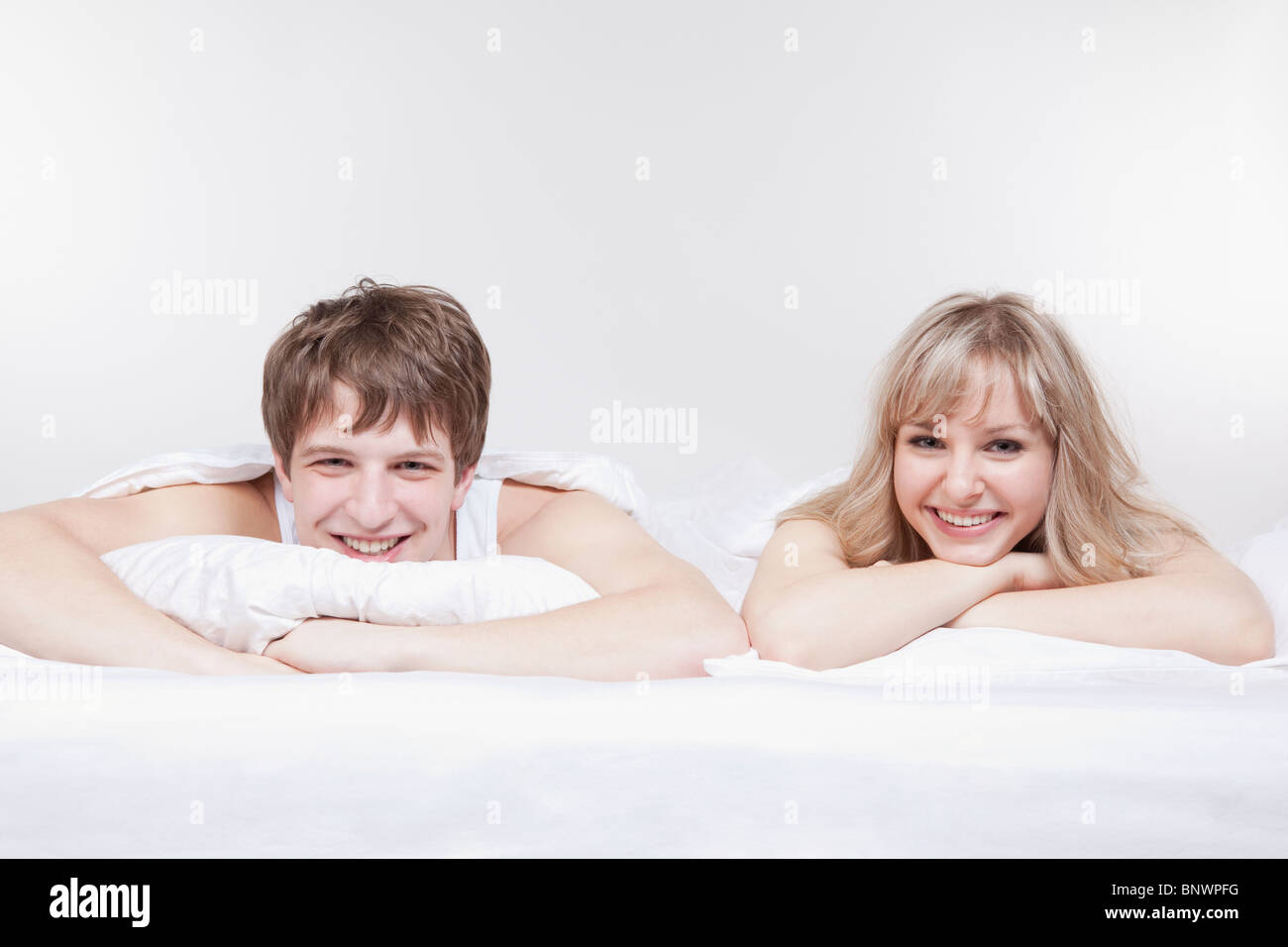 Passionate couple in bed hi-res stock photography and images - Alamy