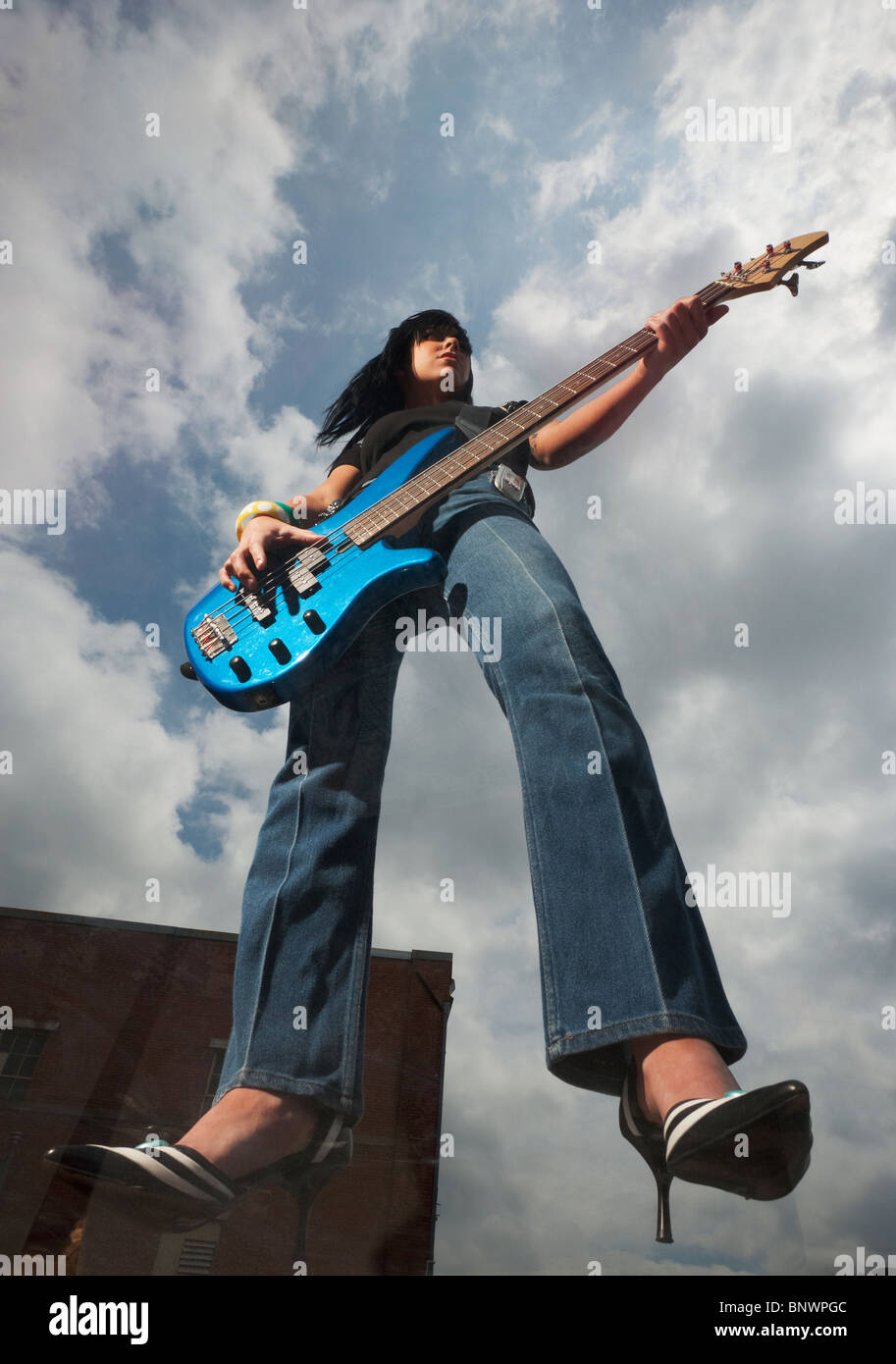 Guitar player suspended in the air Stock Photo - Alamy