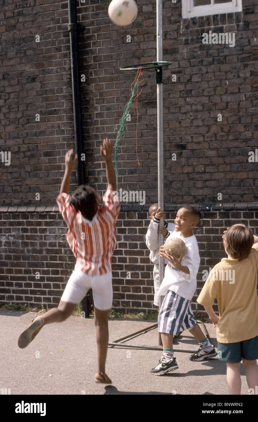 primary school children playing basket ball Stock Photo - Alamy