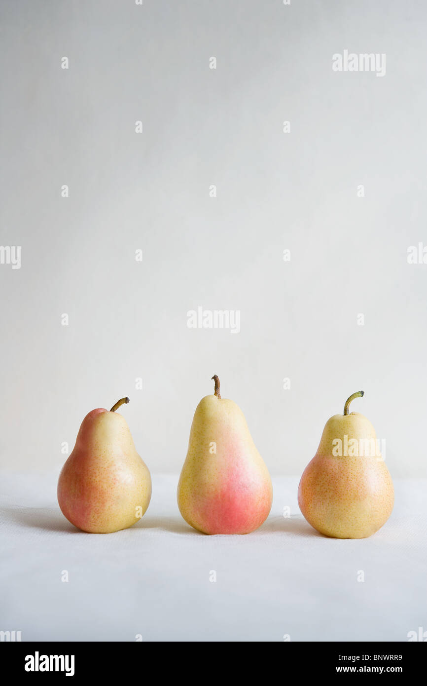 Three pears in a row Stock Photo - Alamy
