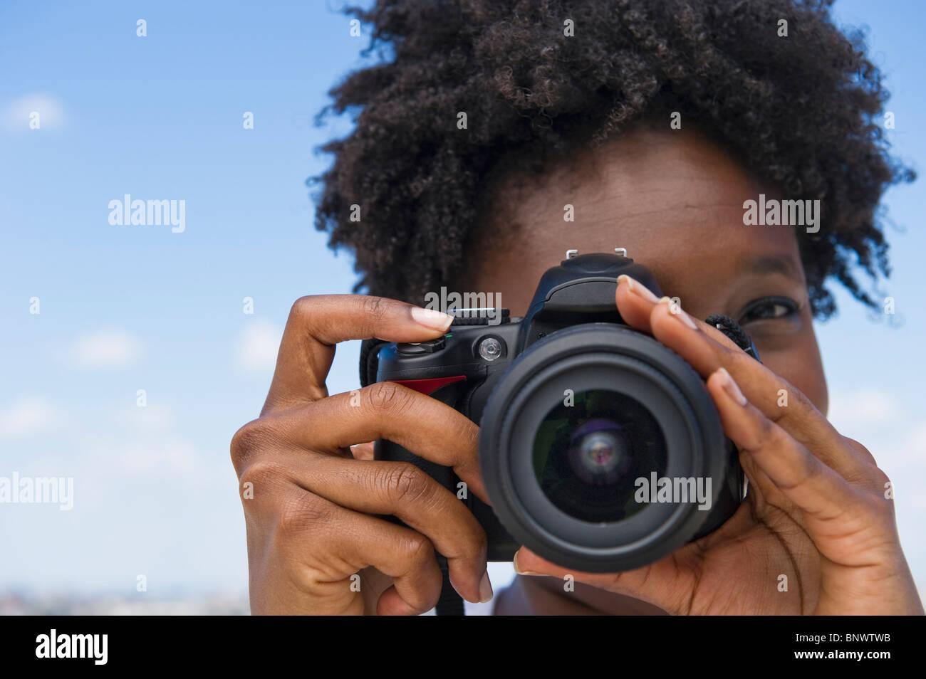 Woman taking picture with a digital camera Stock Photo - Alamy