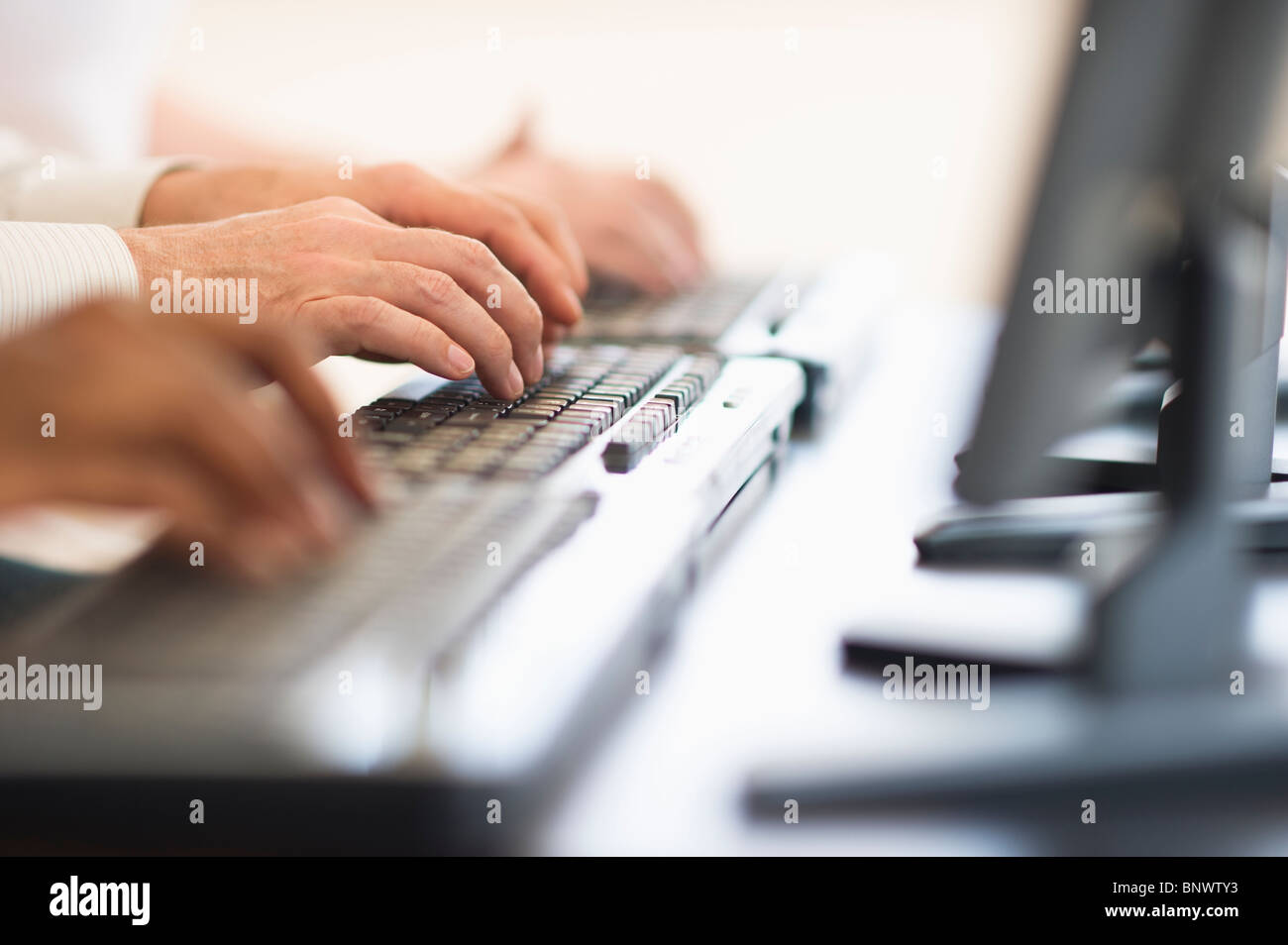 Employees working at computers Stock Photo - Alamy
