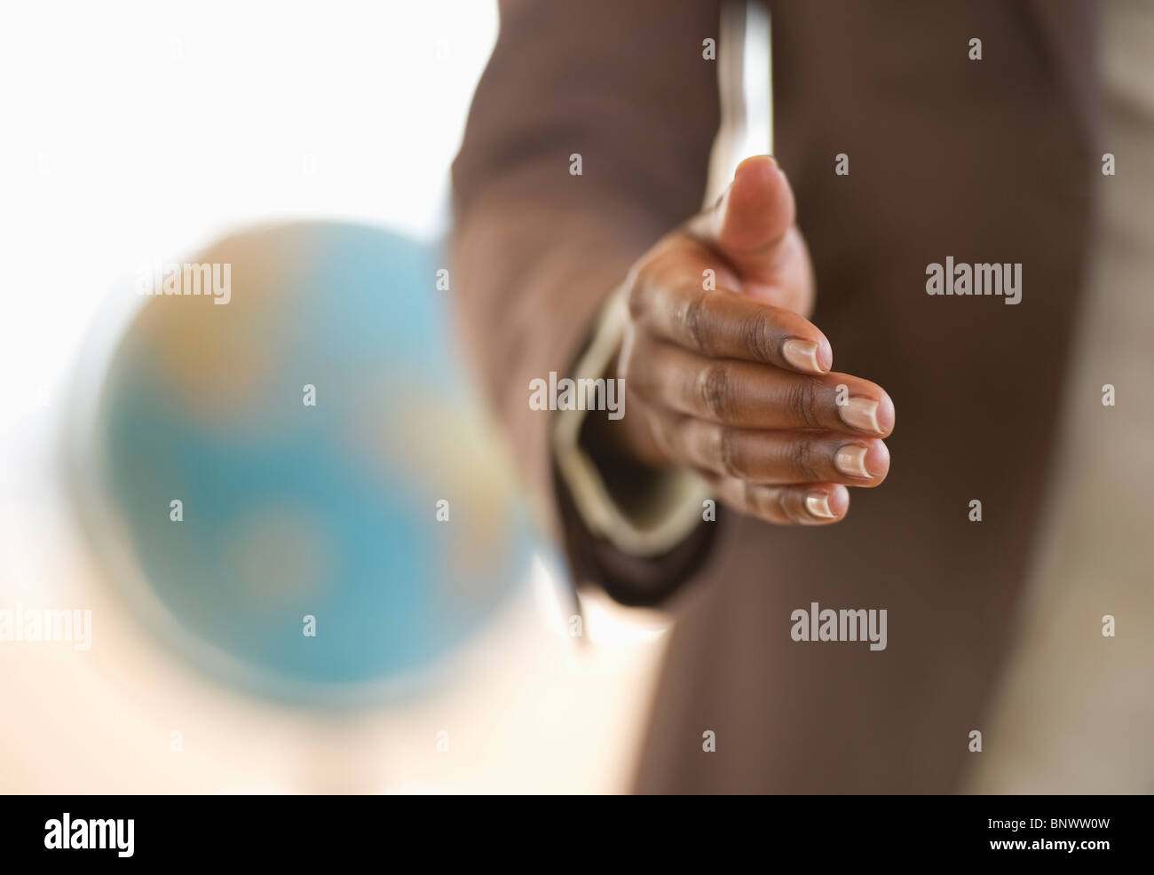 Hand extended for handshake Stock Photo - Alamy