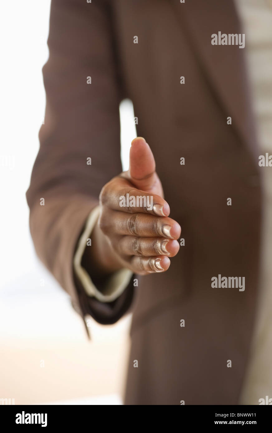 Hand extended for handshake Stock Photo - Alamy