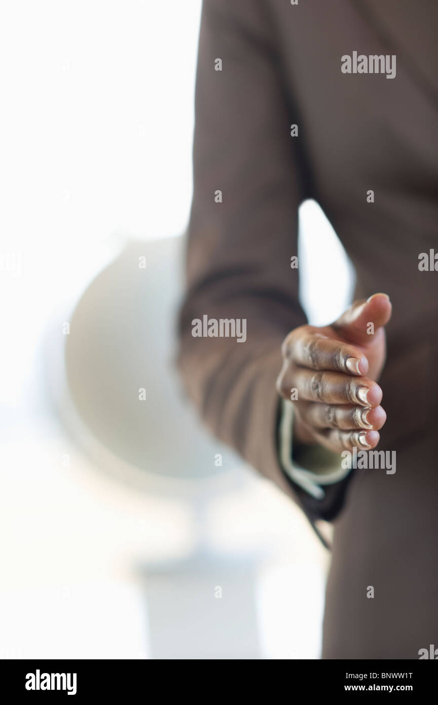 Hand extended for handshake Stock Photo - Alamy