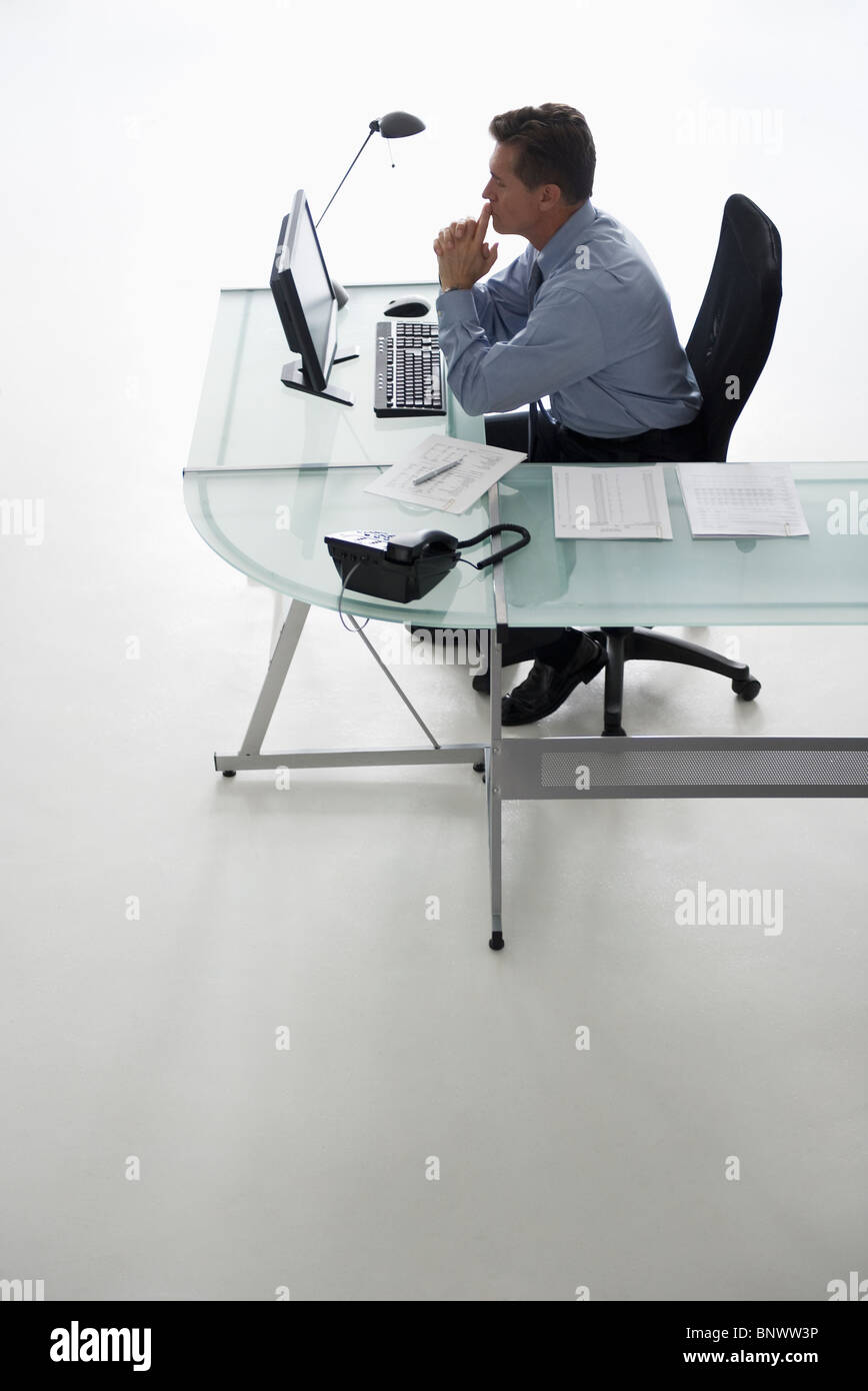 Man working at desk Stock Photo - Alamy