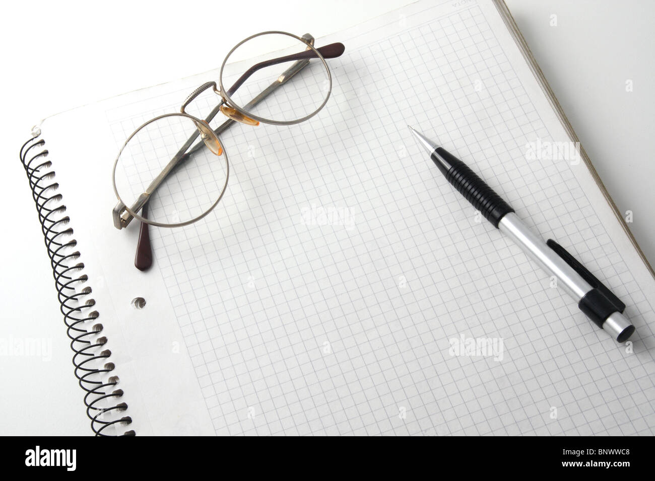 glasses and pencil on an open notebook Stock Photo - Alamy
