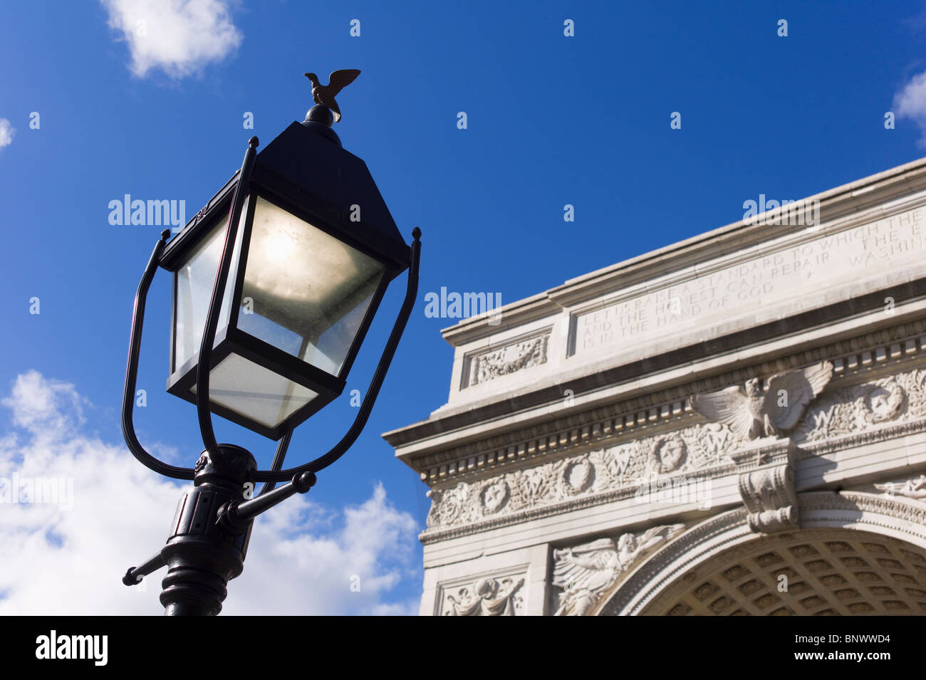 Lamp post in front of Washington Square arch Stock Photo - Alamy