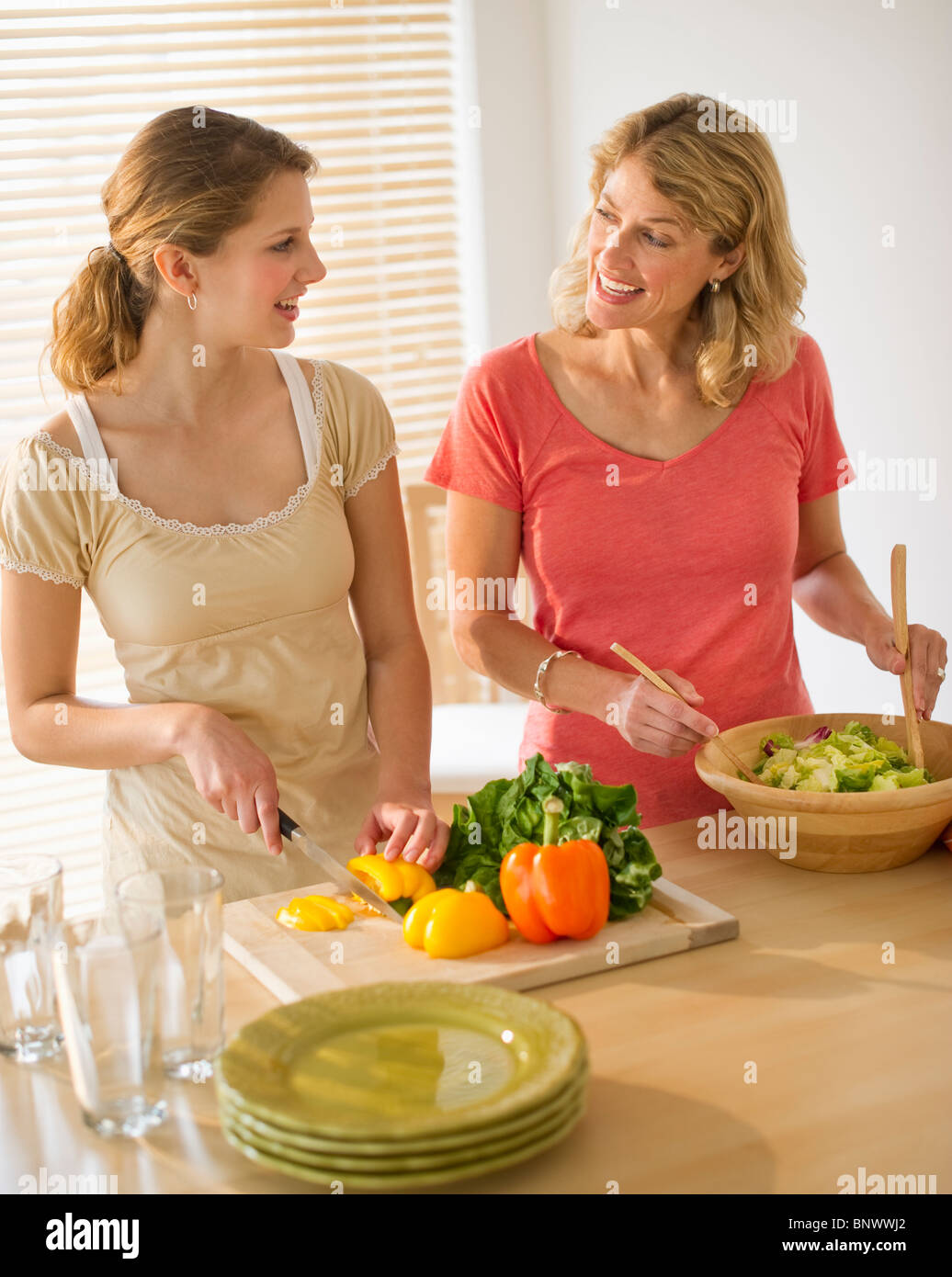 Two women preparing salad Stock Photo - Alamy