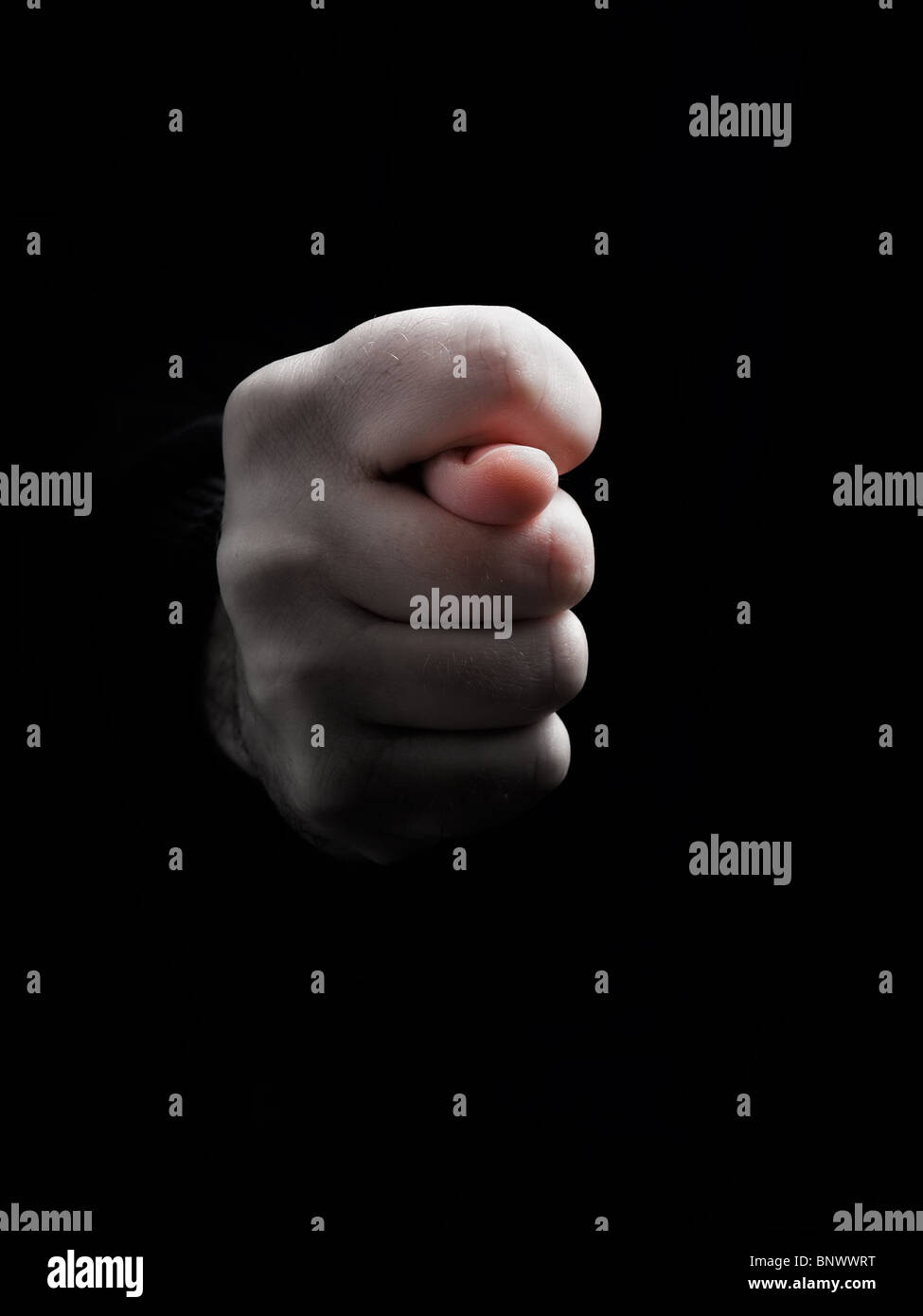 Gesture as cross fingers on dark background Stock Photo - Alamy