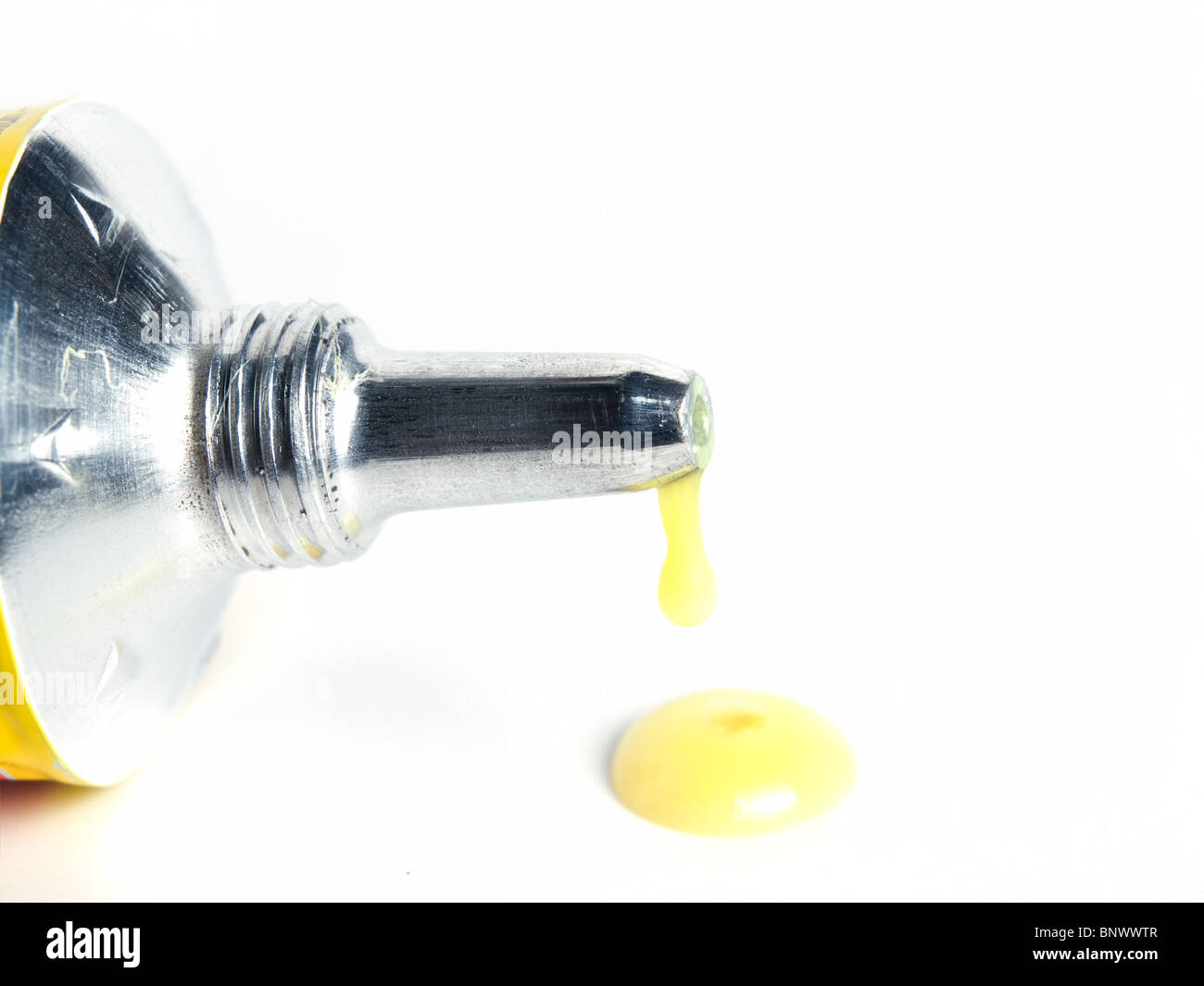 Leaking glue closeup on a white background Stock Photo - Alamy