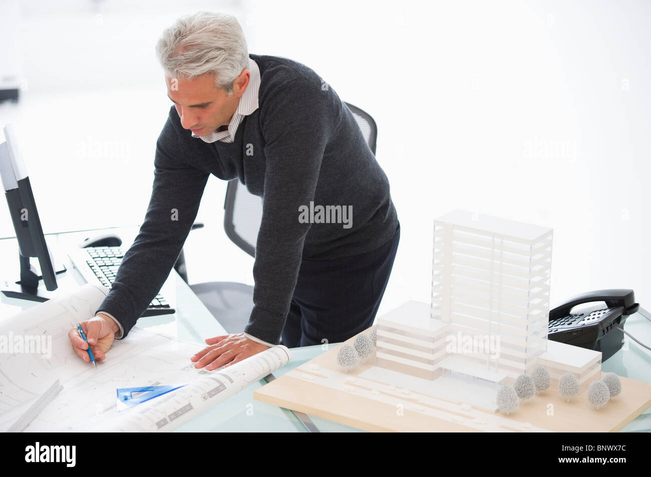 Architect working on house plans Stock Photo - Alamy
