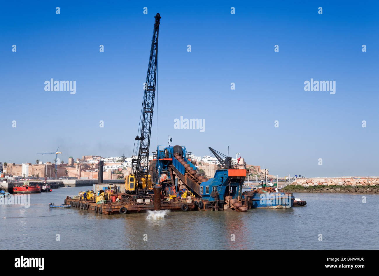 Riverfront with floating pile-driving platform, Oued Bou Regreg (River ...