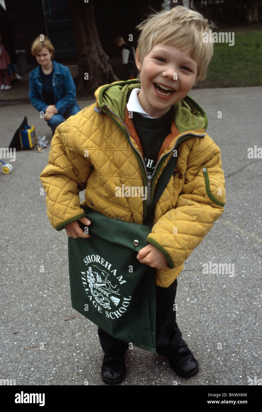 happy boy coming home from school Stock Photo - Alamy