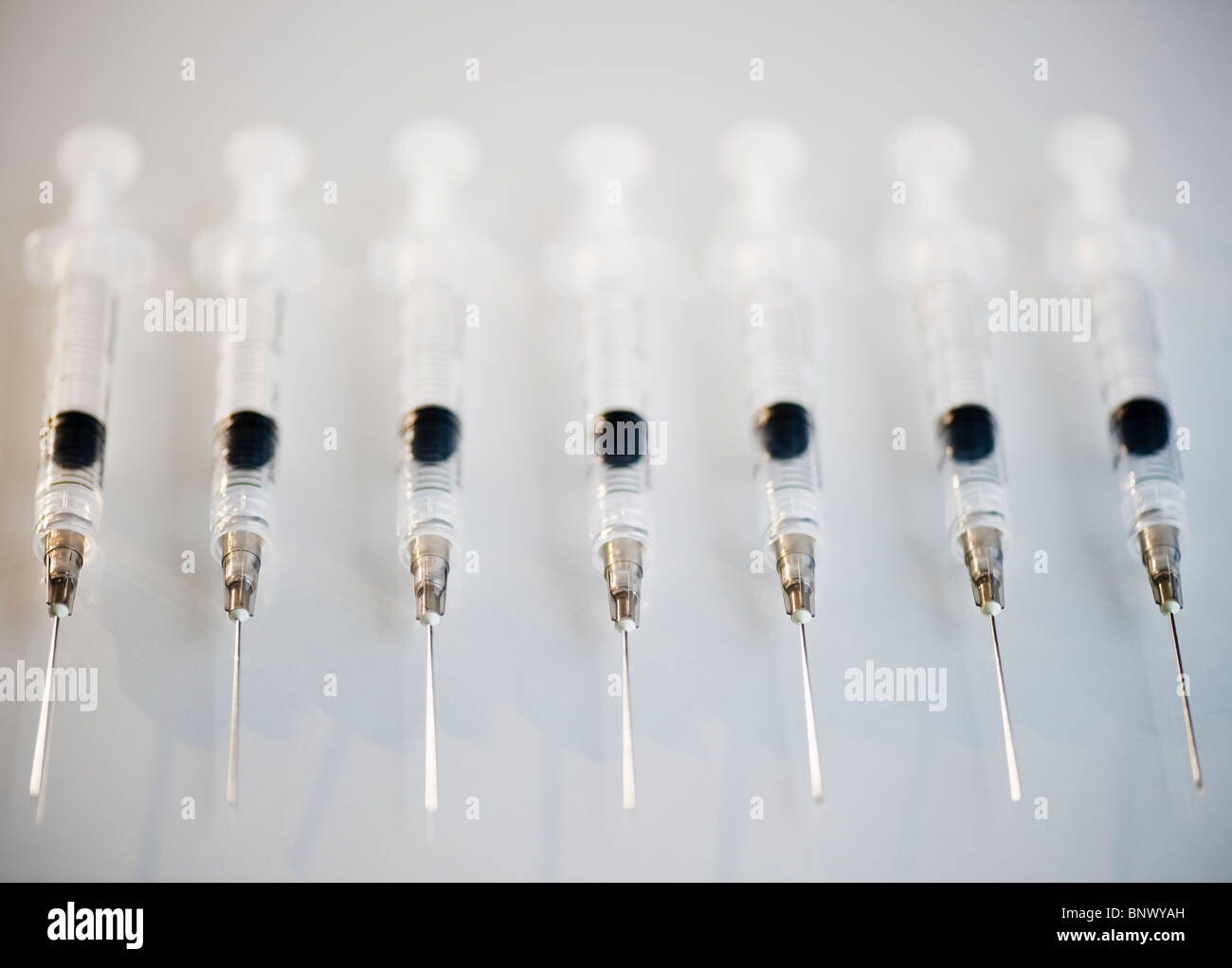 Row of medical syringes Stock Photo - Alamy