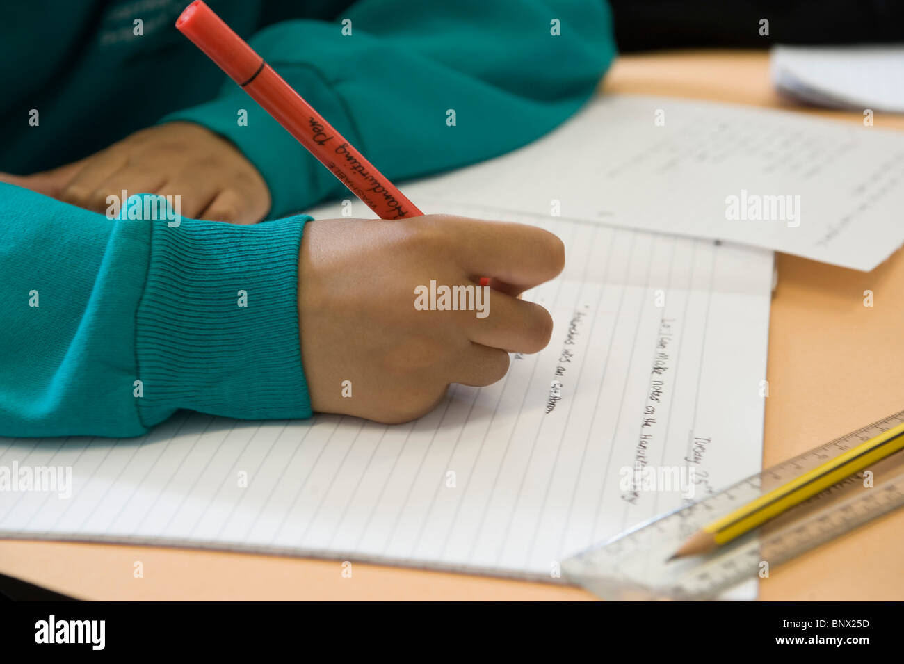 Child writing classroom ruler hi-res stock photography and images - Alamy