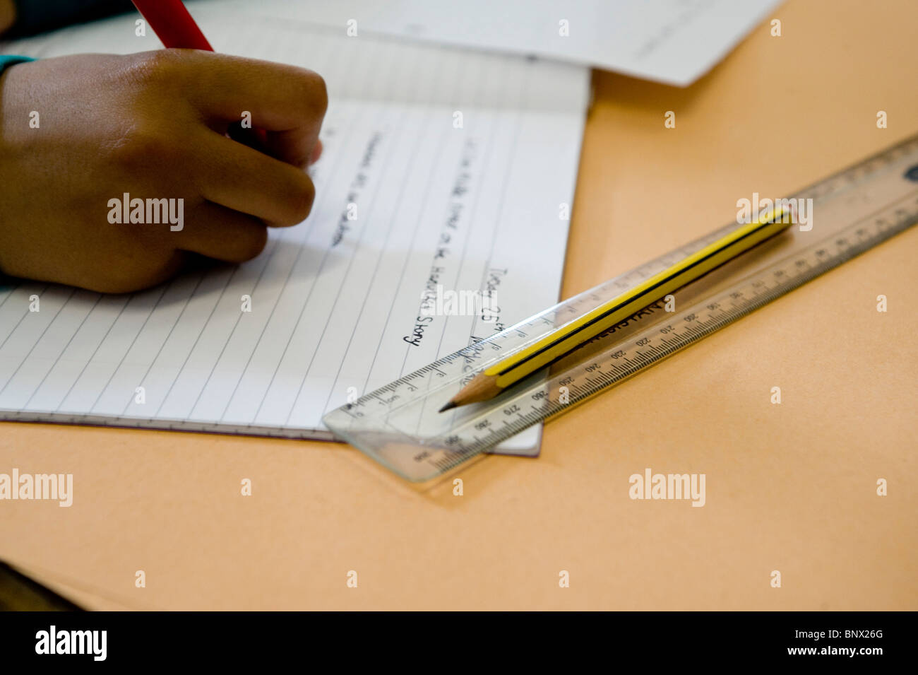 Child writing classroom ruler hi-res stock photography and images - Alamy