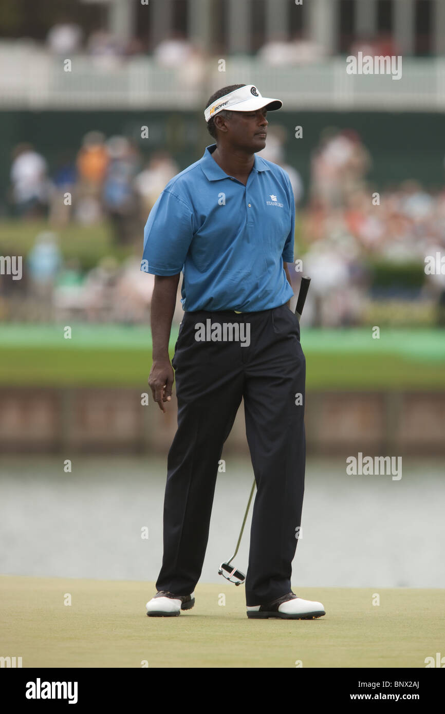 Vijay Singh putts on the 17th green during a practice round of the 2009 ...