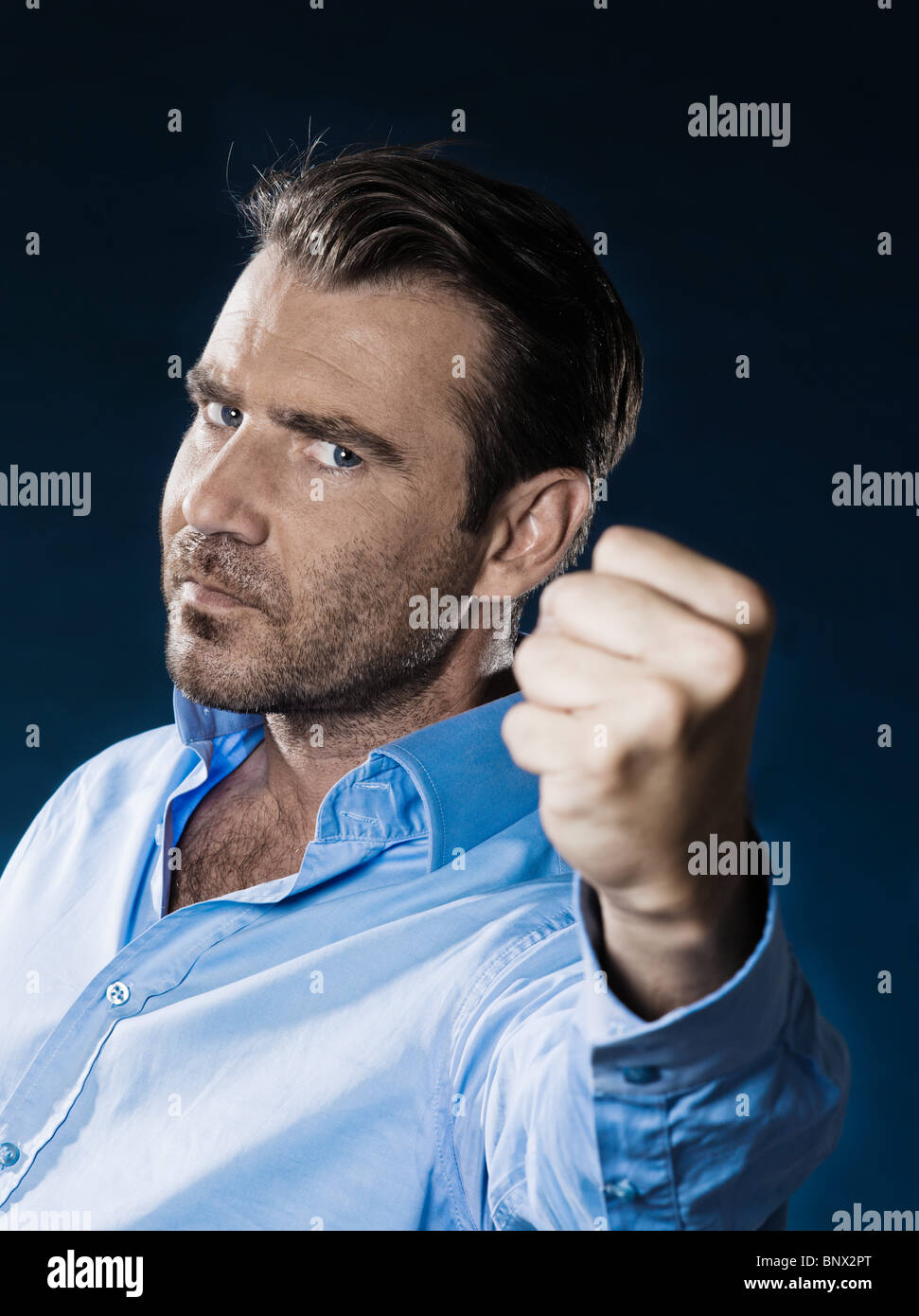 caucasian man unshaven angy menacing portrait isolated studio on black ...
