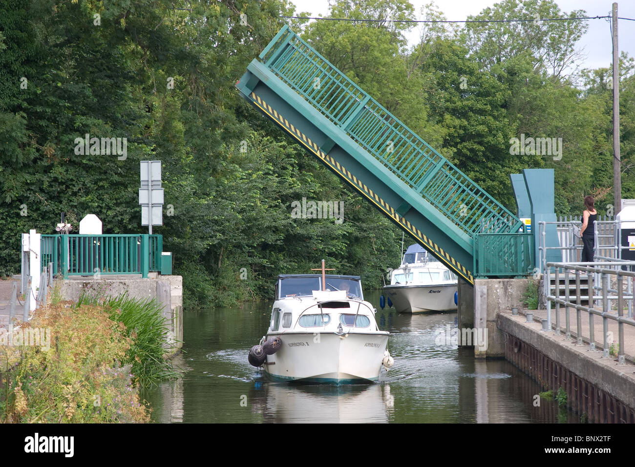 Large leisure boat Bascule lifting bridge boating Stock Photo - Alamy