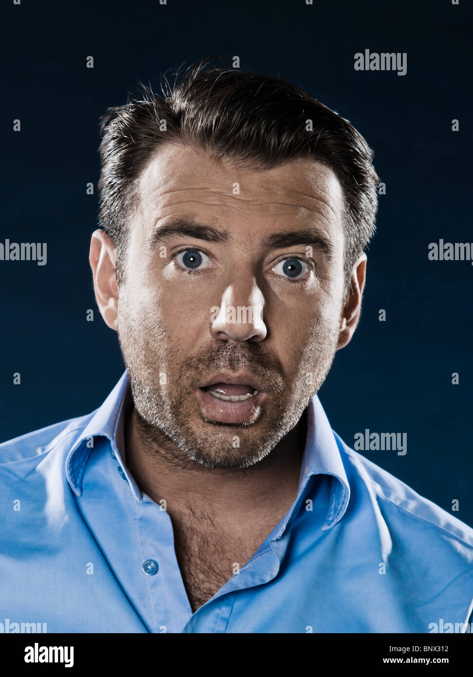 caucasian man unshaven shocked portrait isolated studio on black ...