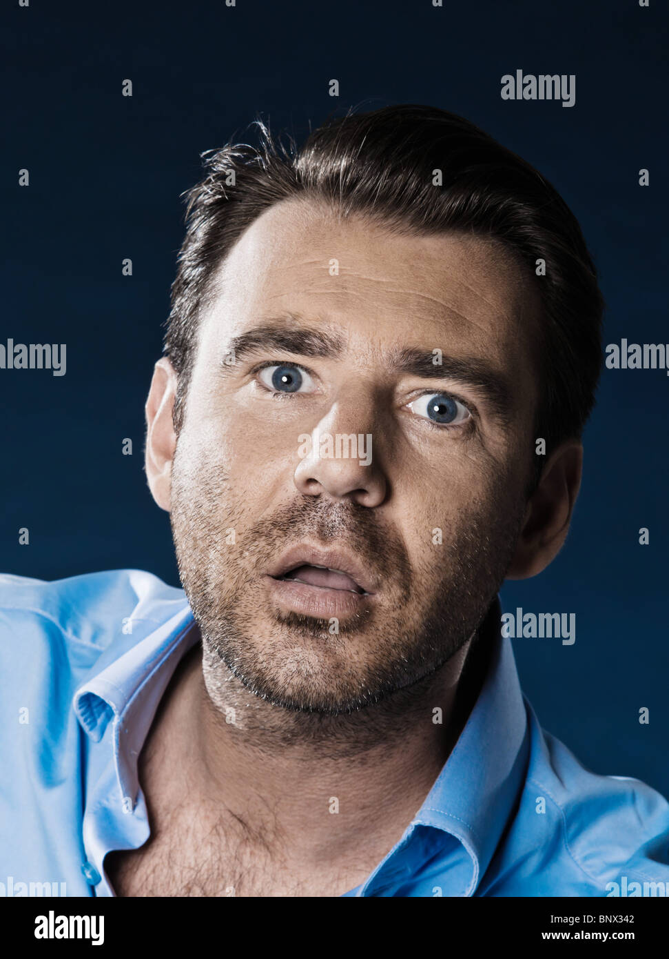 caucasian man unshaven stuned daze portrait isolated studio on black ...