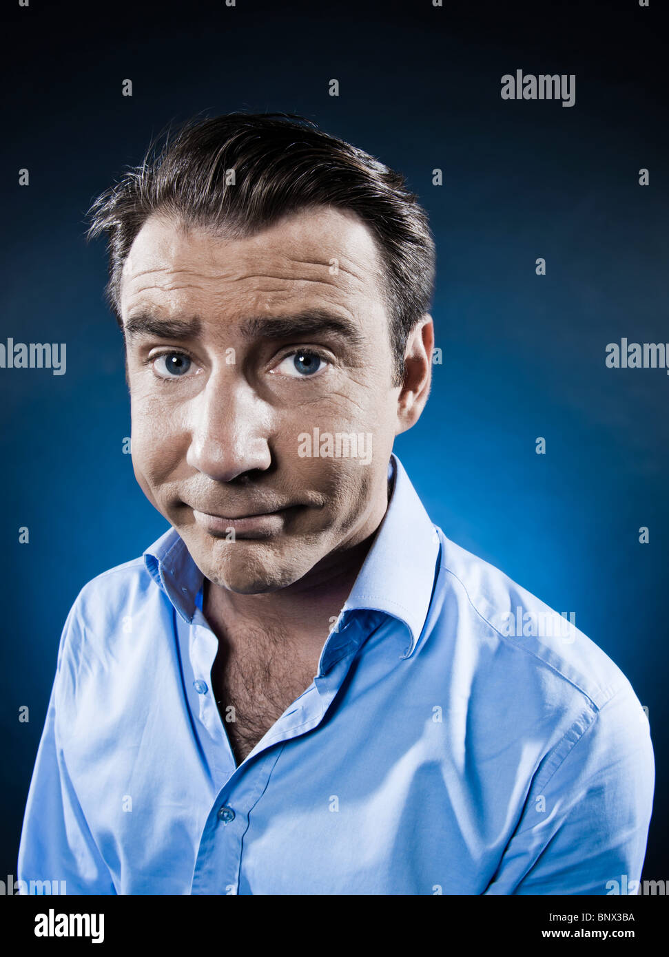 caucasian man frowning sullen portrait isolated studio on black ...