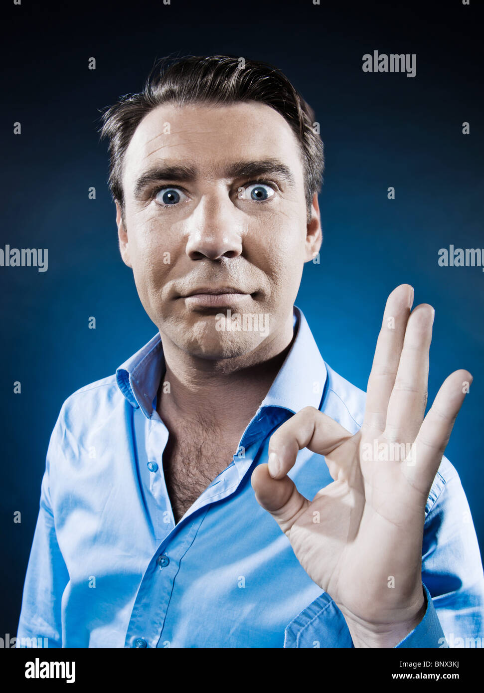 caucasian man ok sign agreement portrait isolated studio on black ...
