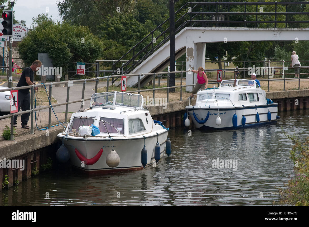 moored mooring boating cruiser pleasure boat craft Stock Photo - Alamy