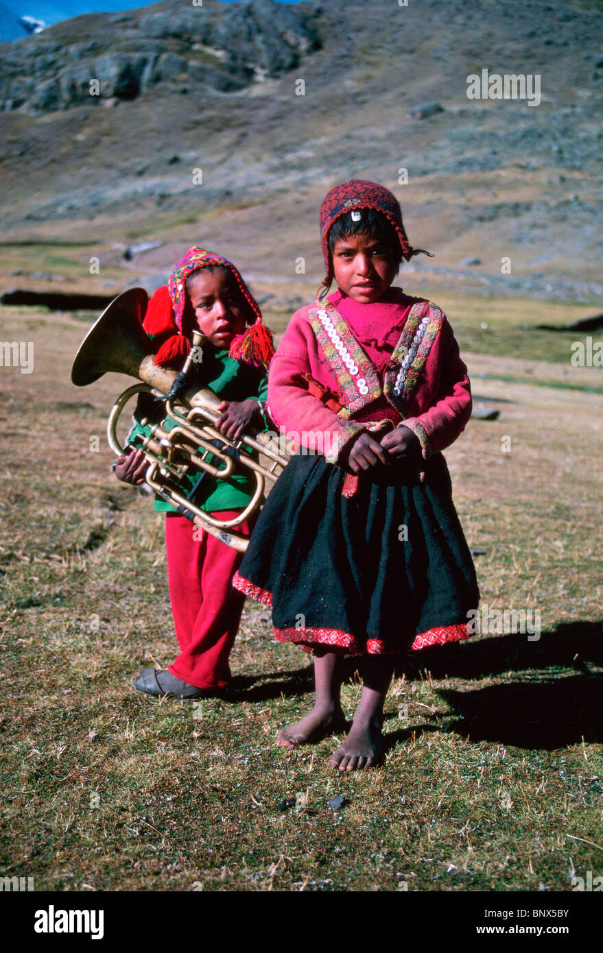 Peruvian highland musician and girl at 15,000 feet altitude, under ...