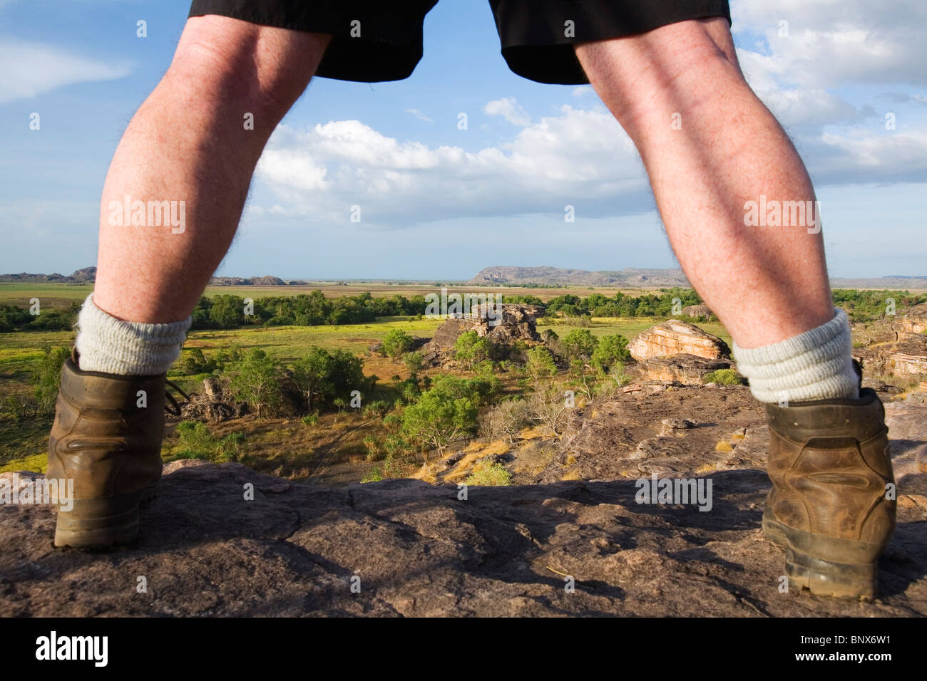 Hiker at the Nadab lookout, overlooking the floodplains. Ubirr, Kakadu National Park, Northern ...