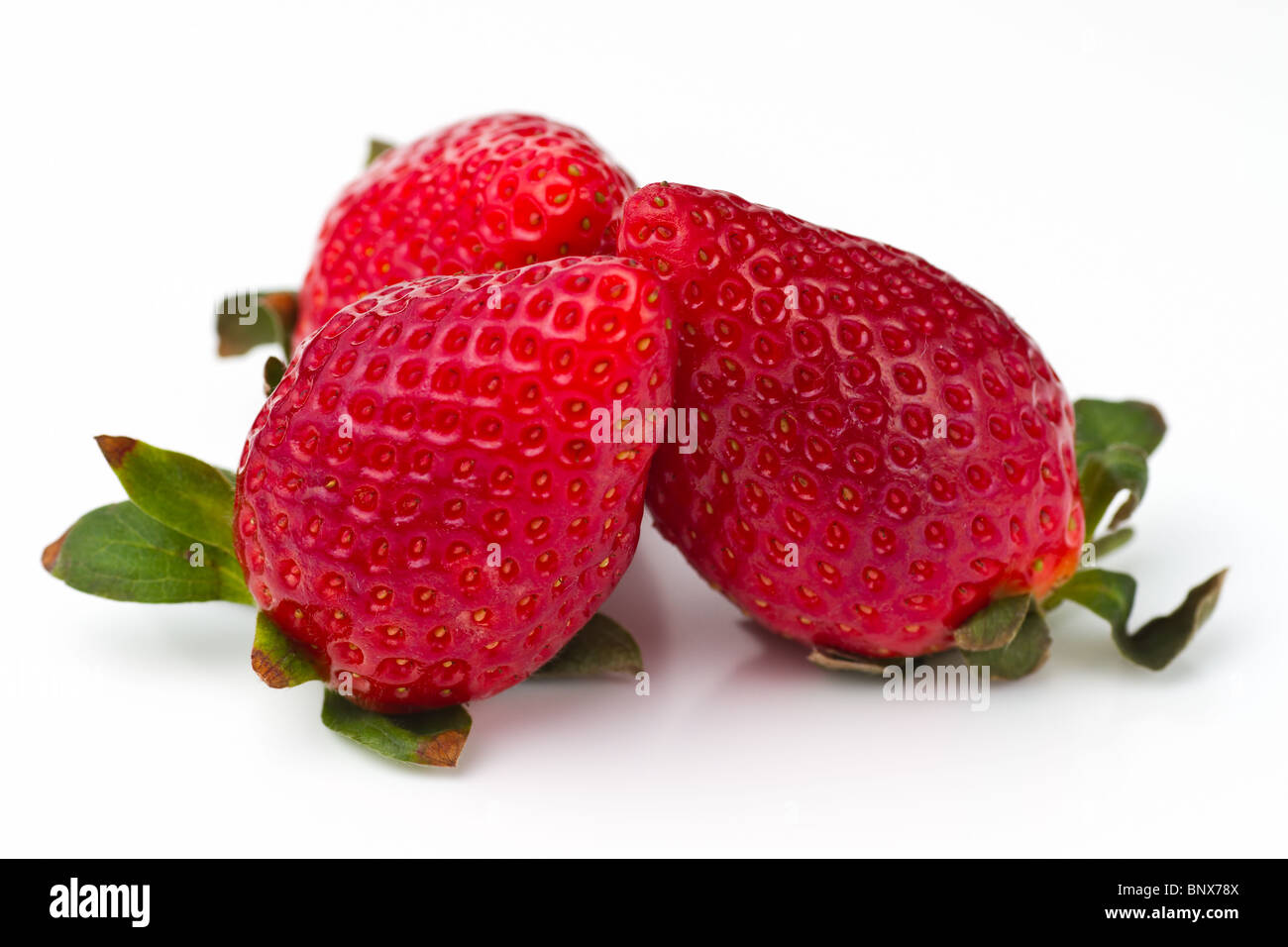 3 three whole strawberries Stock Photo - Alamy