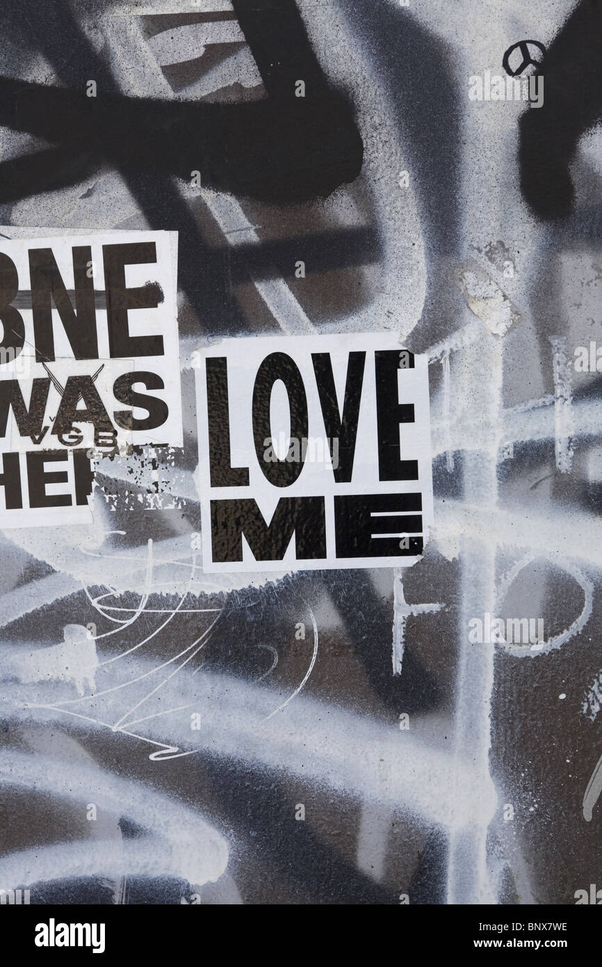 Graffiti wall with Love Me poster on the Lower East Side of Manhattan ...