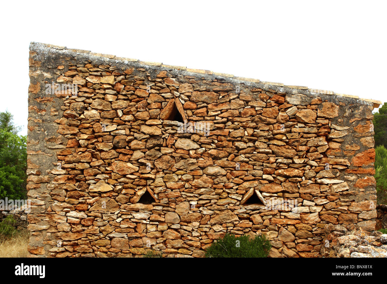 Masonry stone wall triangle windows hi-res stock photography and images ...