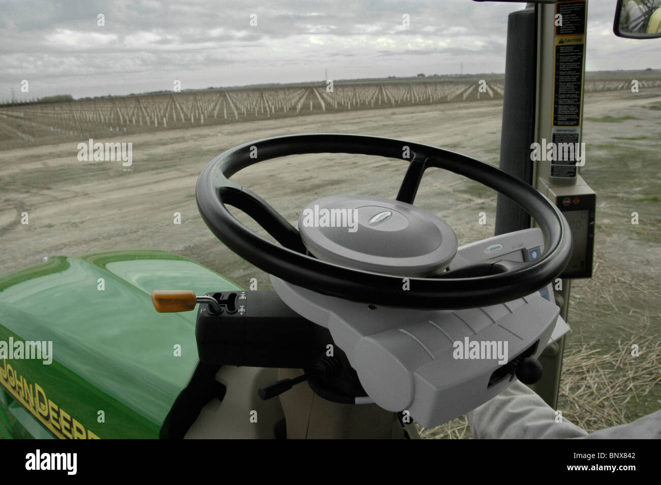A tractor driver with GPS navigation for accurate field grading Stock ...
